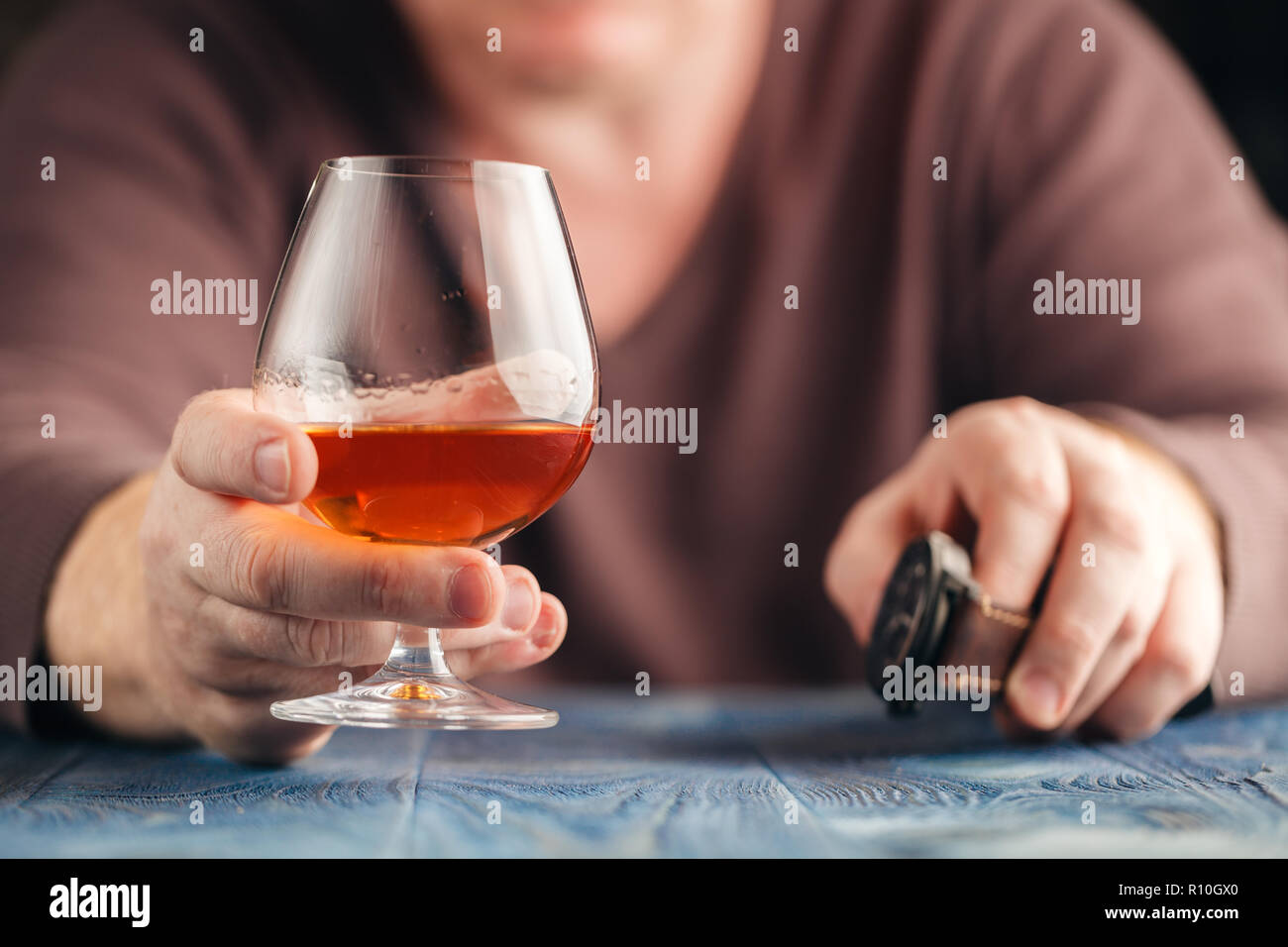 Alcohol abuse, alone man drink whisky for relax Stock Photo - Alamy