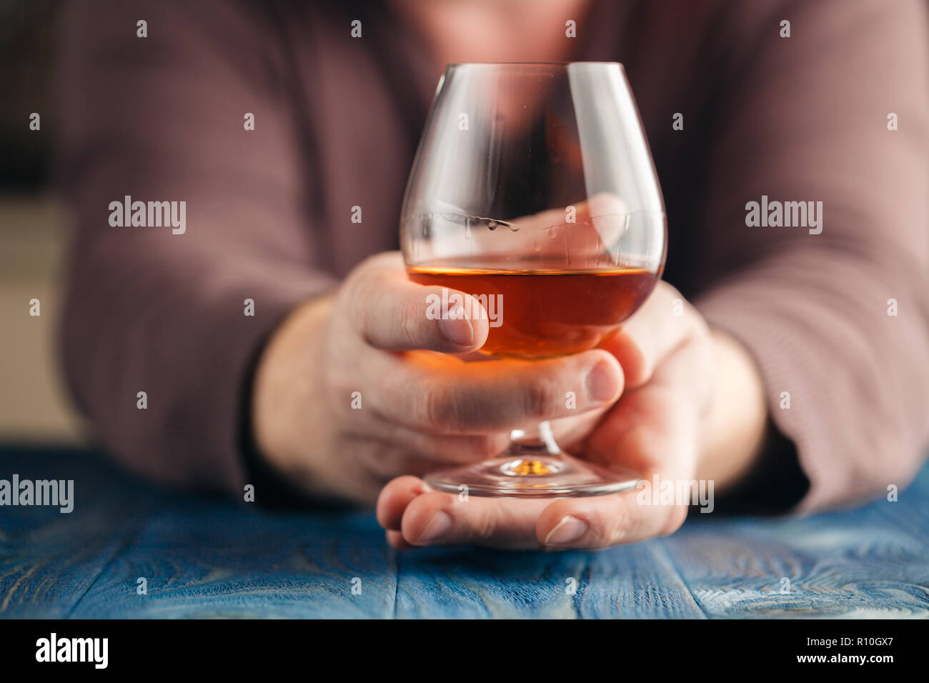 Man alone relax with alcohol after hard work Stock Photo - Alamy