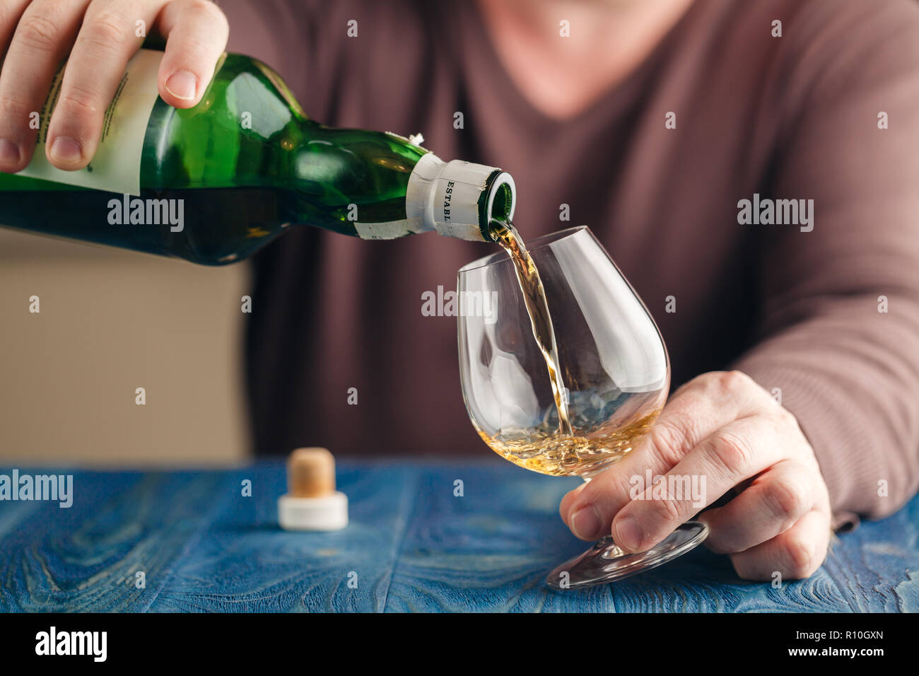 Hand pouring liquor isolated hi-res stock photography and images - Alamy