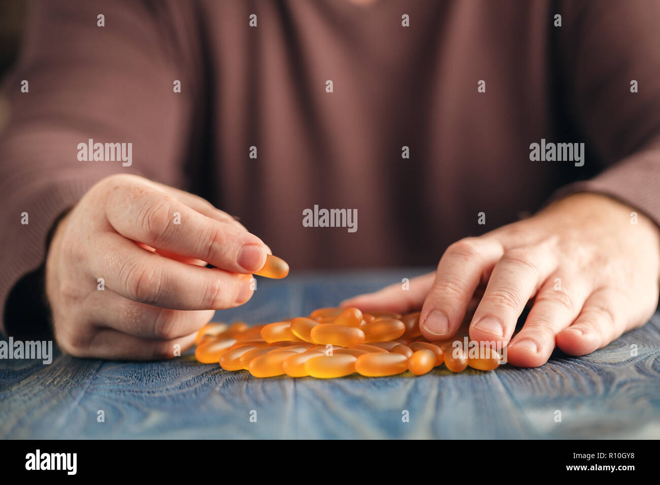 Close up man fish oil hi-res stock photography and images - Alamy