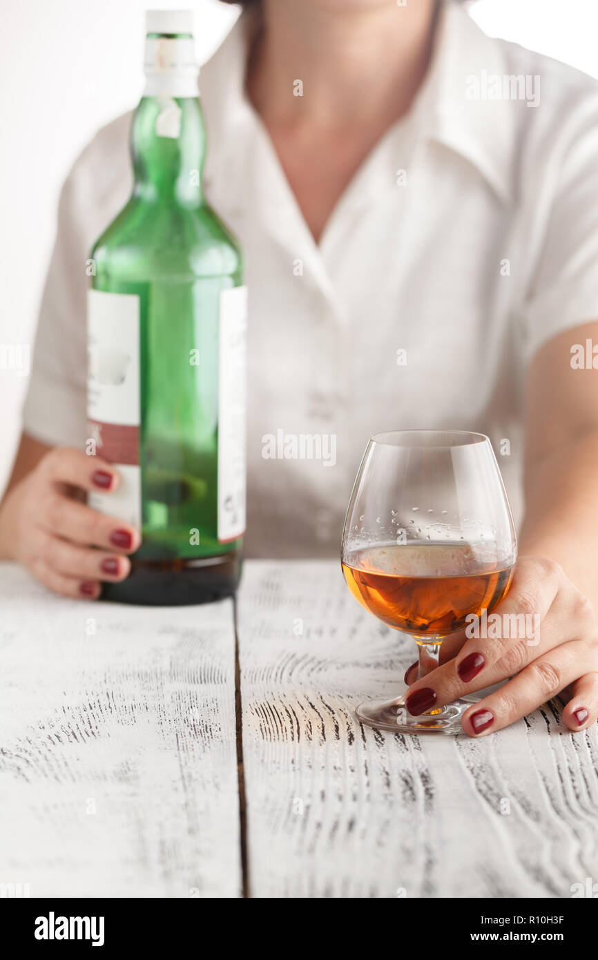 Alcoholism issue, drinking after hard work Stock Photo - Alamy