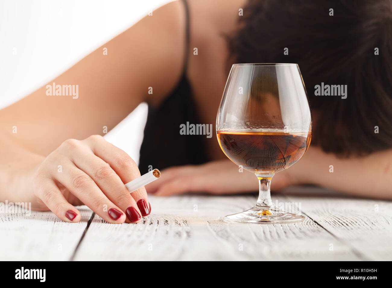 Woman alcoholism is social problem. Female drinking of whiskey is cause ...