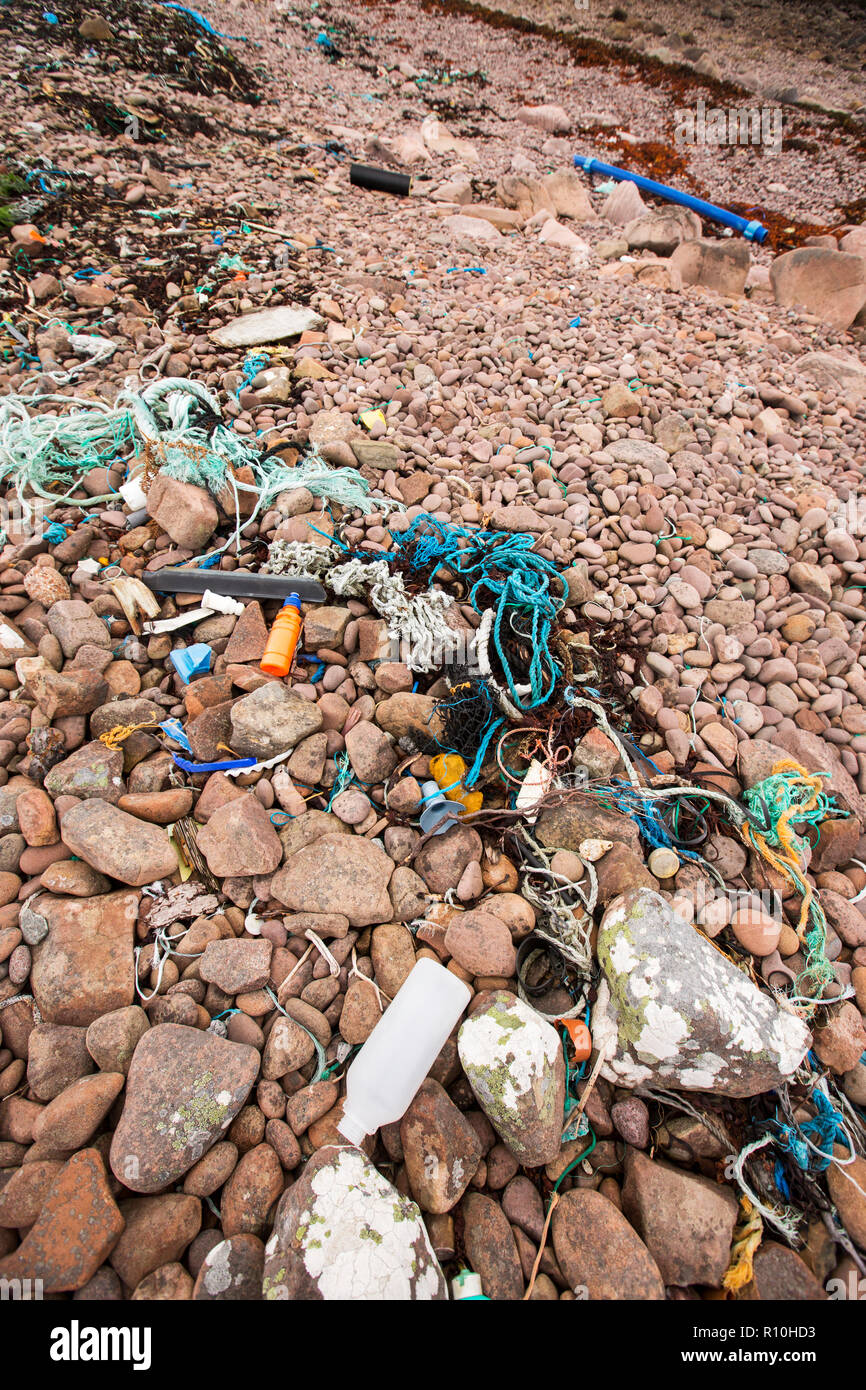 Fishing netting and other plastics in the tide wrack, washed ashore on ...