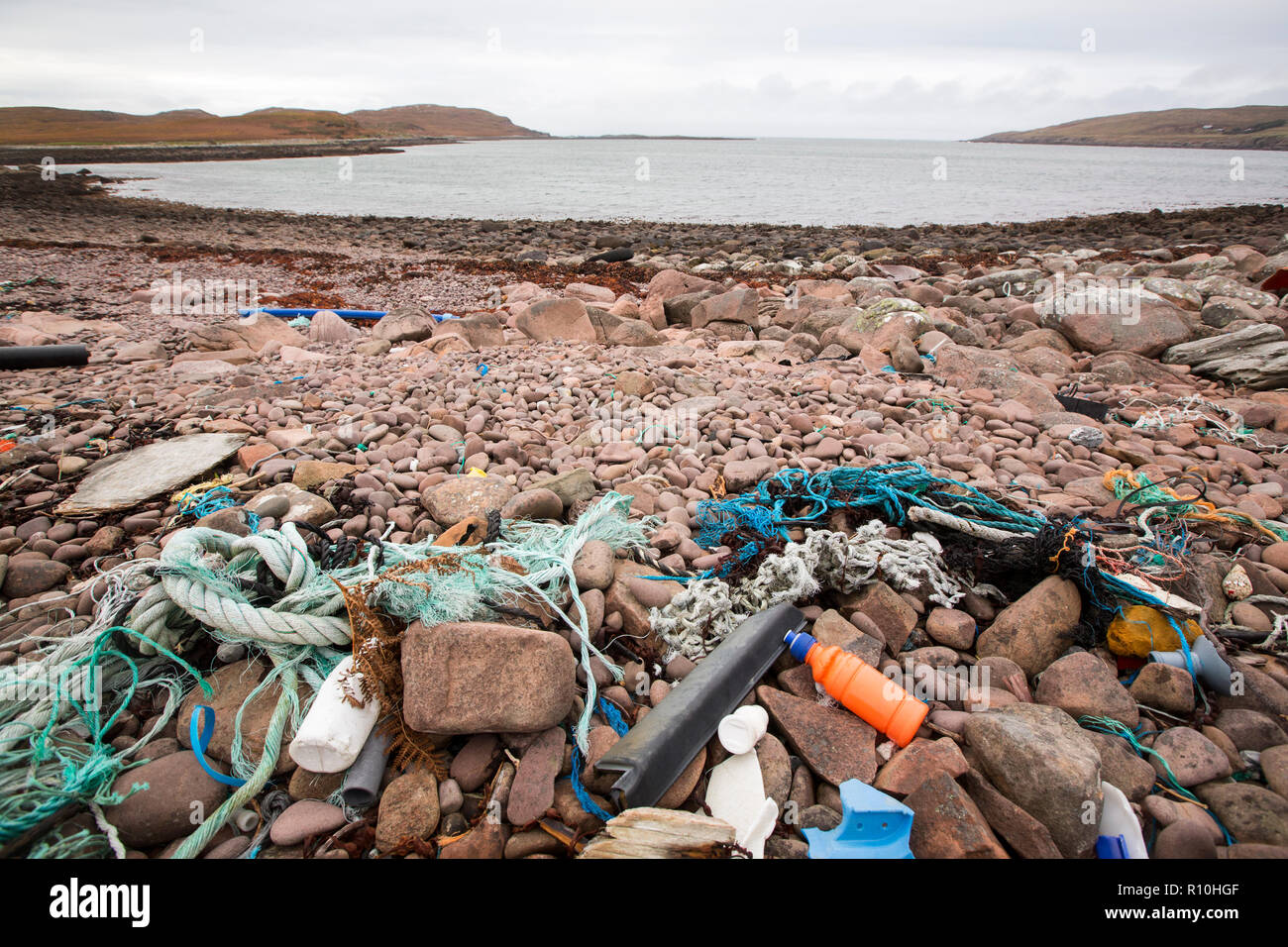 Fishing netting and other plastics in the tide wrack, washed ashore on ...