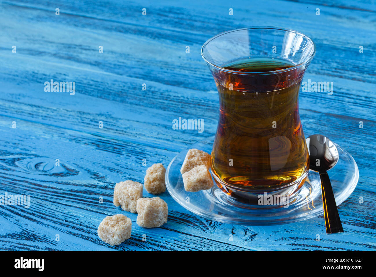 Azerbaijan cuisine. Traditional tea in special cups of glass in the ...