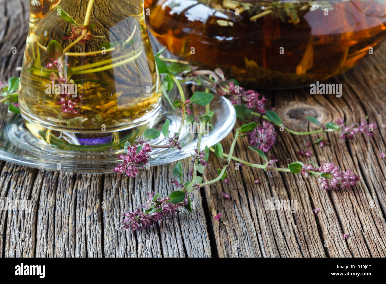 Middle East Black tea with thyme, ethnic glass and glass teapot ...