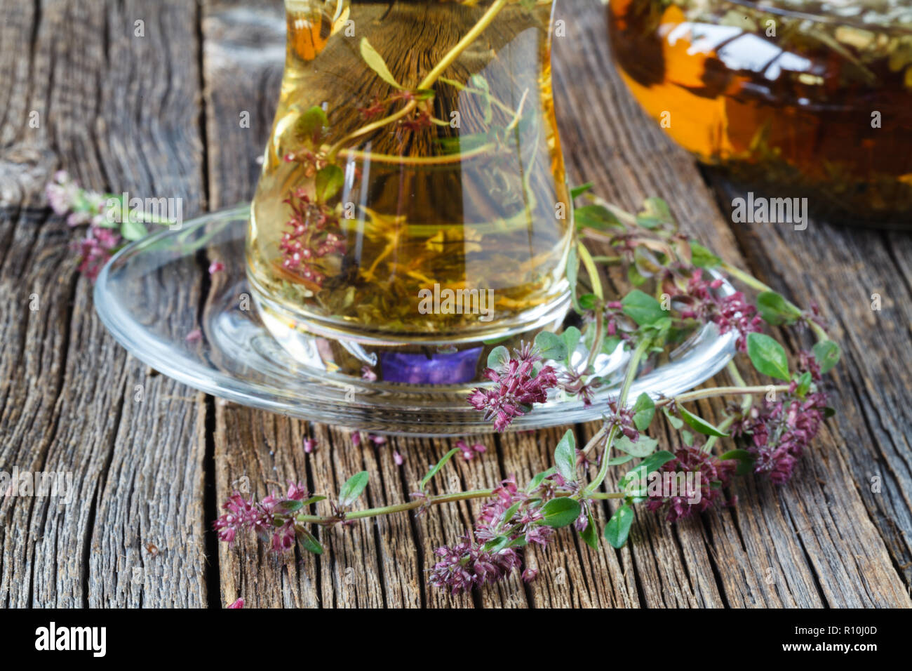 Middle East Black tea with thyme, ethnic glass and glass teapot ...