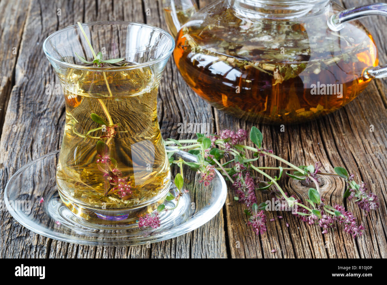 Azerbaijan cuisine. Traditional tea in special cups of glass in the ...