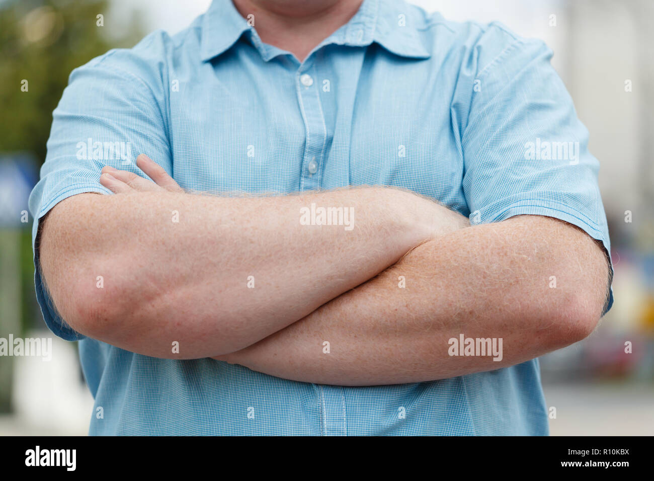 Serious muscular man arms folded hi-res stock photography and images ...