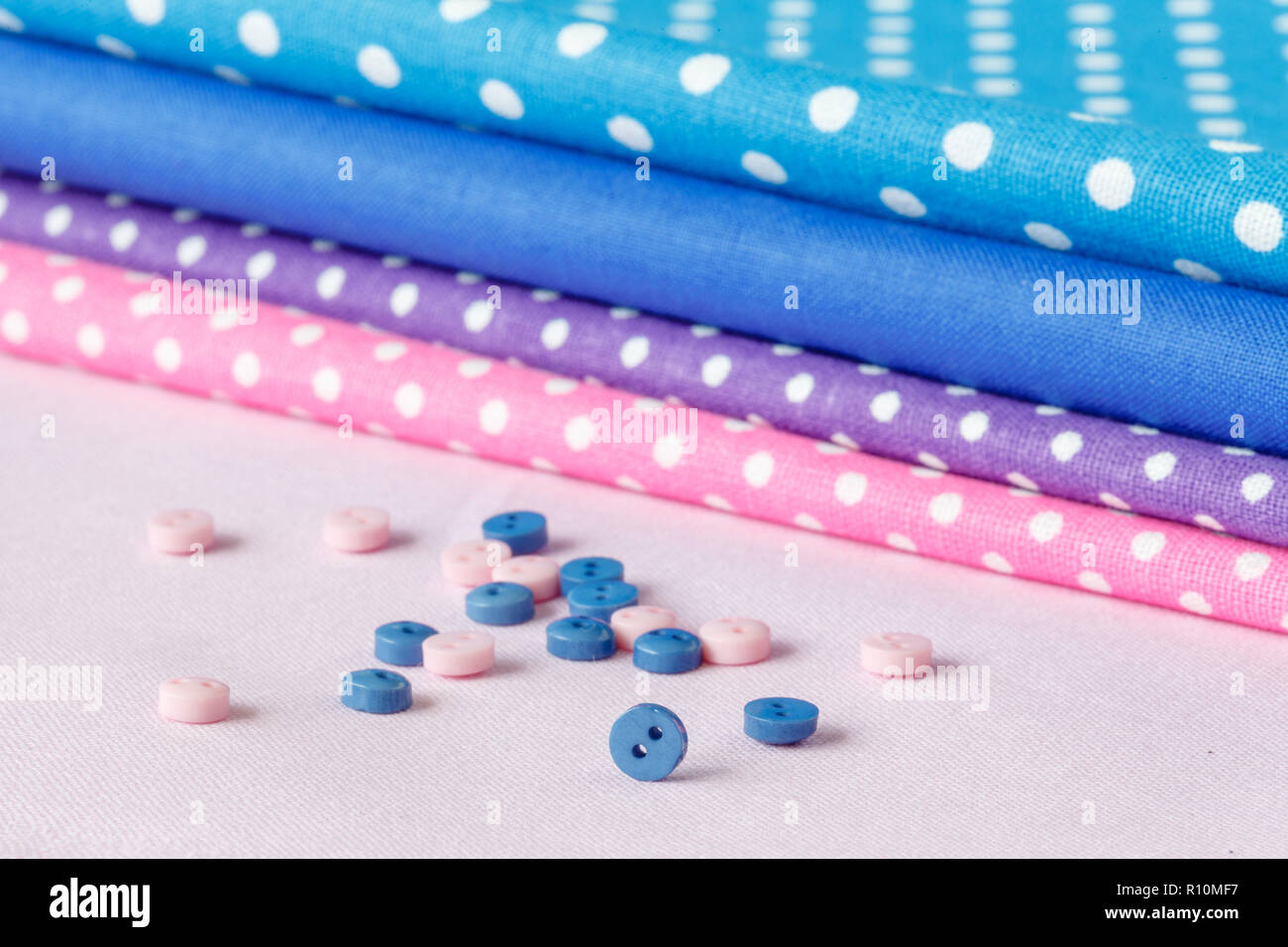 Tailoring. fabric, buttons need sewing clothes Stock Photo - Alamy