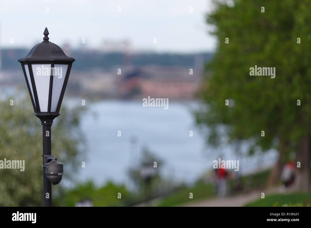 CCTV surveillance camera mounted on vintage street lantern Stock Photo ...