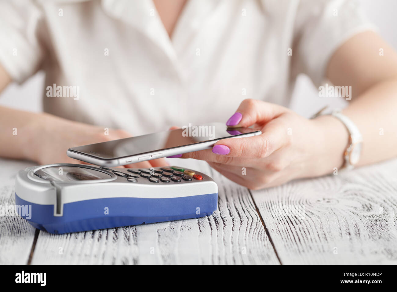 Person using cell phone to pay at store hi-res stock photography and ...