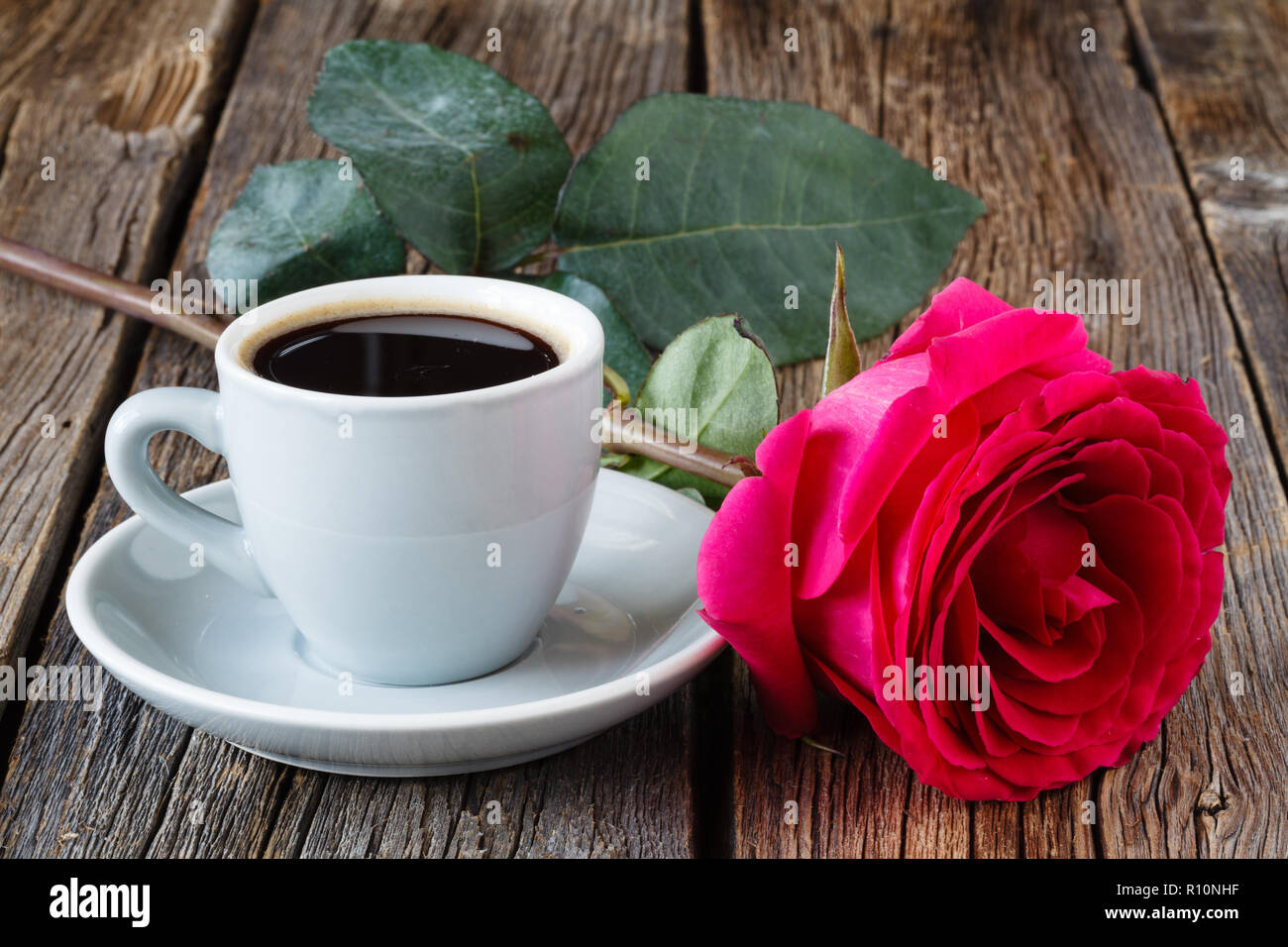 Coffee with red rose Stock Photo - Alamy