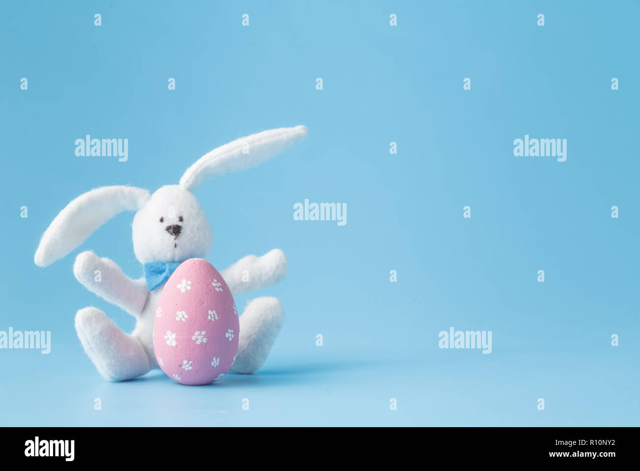 Happy Easter - Toy rabbit and easter eggs Stock Photo - Alamy