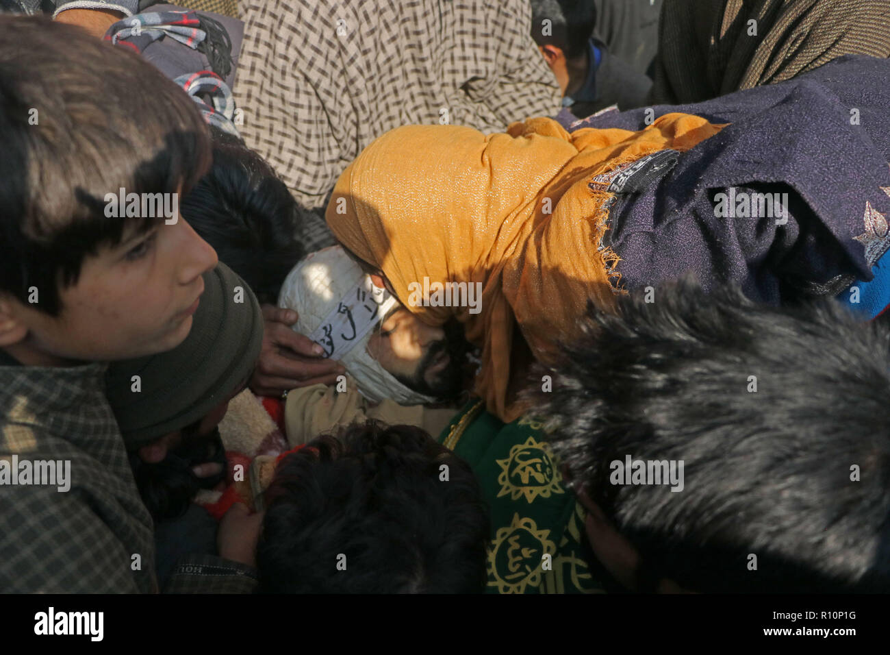 India. 06th Nov, 2018. An unidentified relative kisses the face of ...
