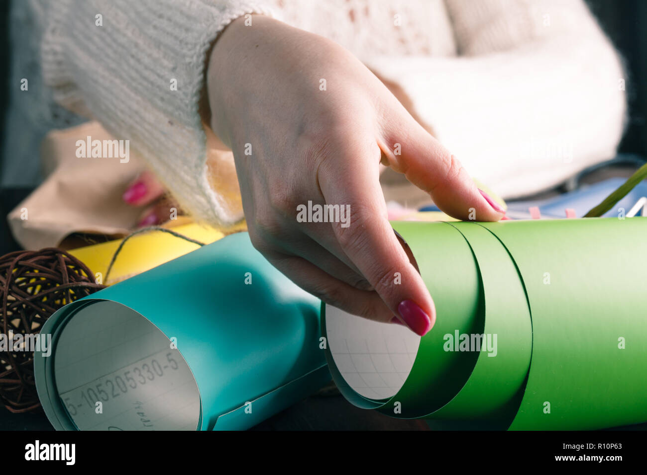 woman papercraft work, wrap gift in decoration paper Stock Photo - Alamy