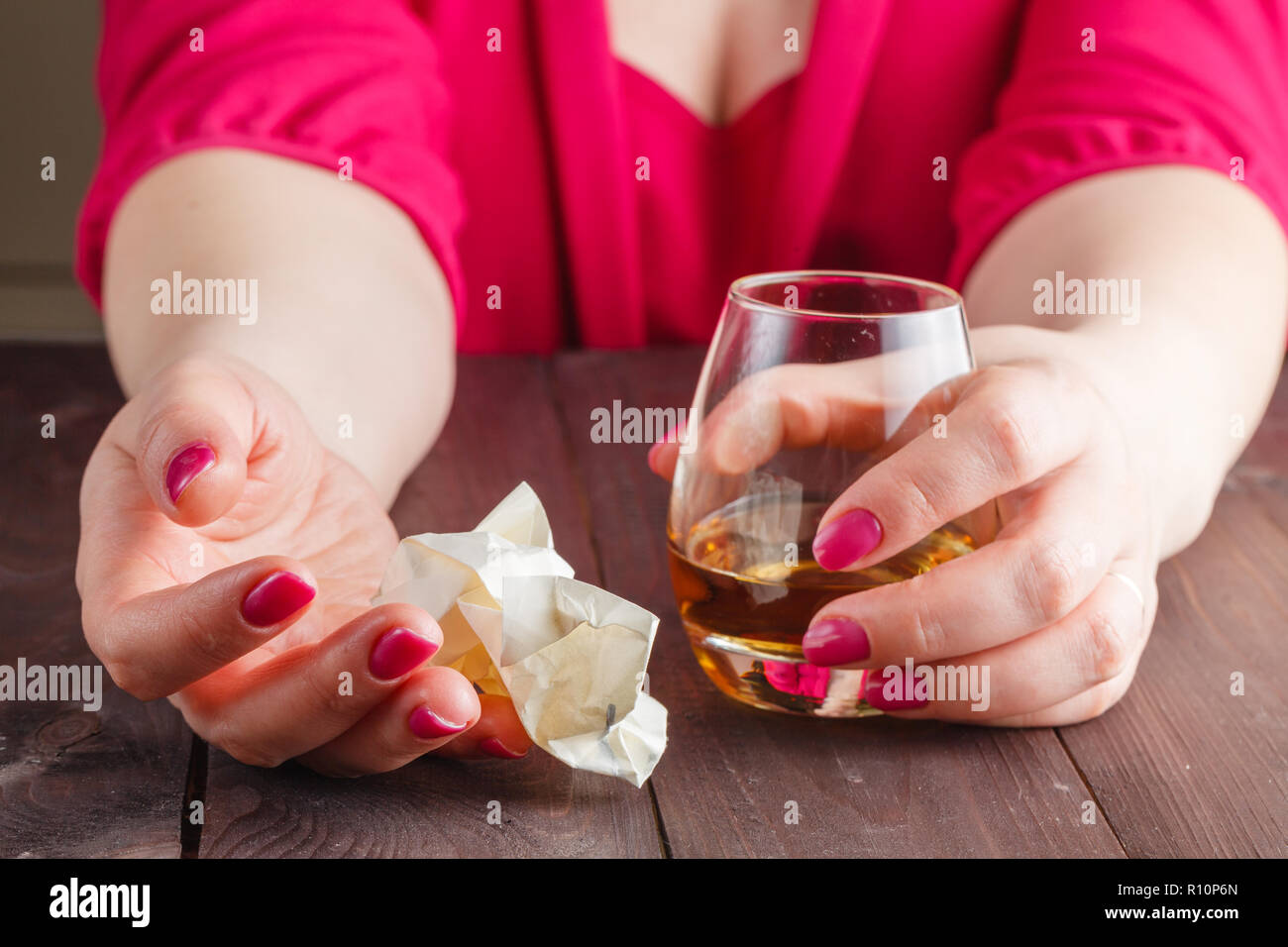 woman crush paper note and drink alcohol Stock Photo - Alamy