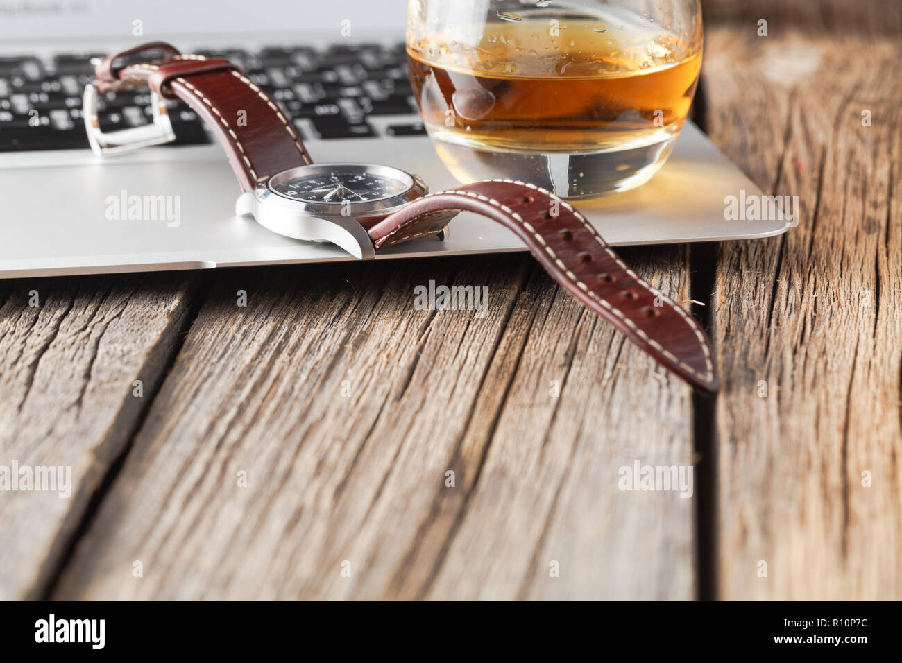 whiskey glass on laptop Stock Photo - Alamy