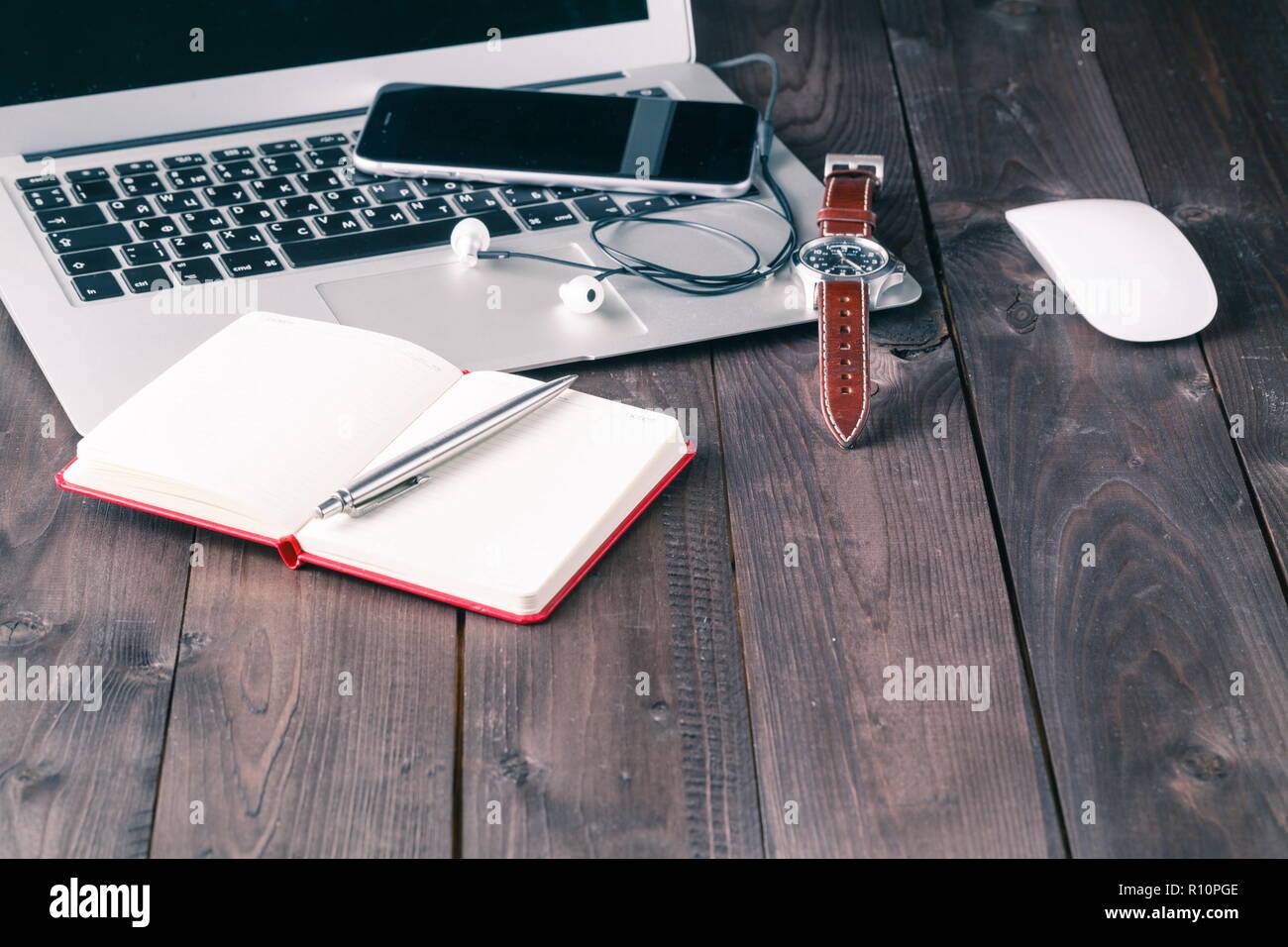 Office desk with laptop computer, planner, mobile smartphone Stock ...