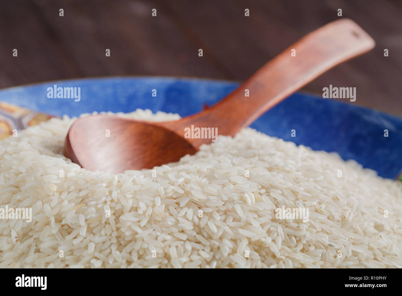 White rice on a plate, big spoon on the side Stock Photo - Alamy