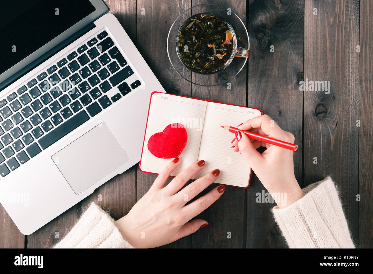 woman using laptop computer Ñ‚Ð² drawing red heart Stock Photo - Alamy