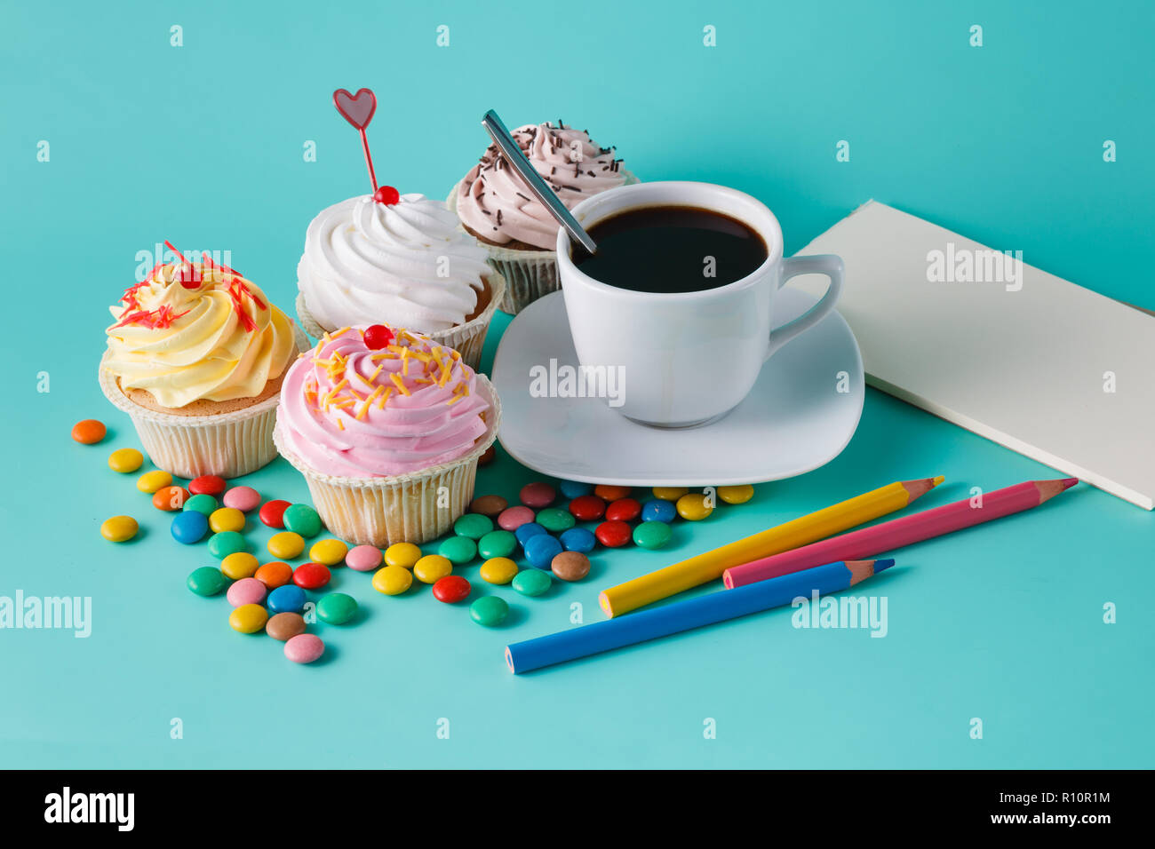 Party concept. Cupcakes with colorful confetti, color pen and coffee ...