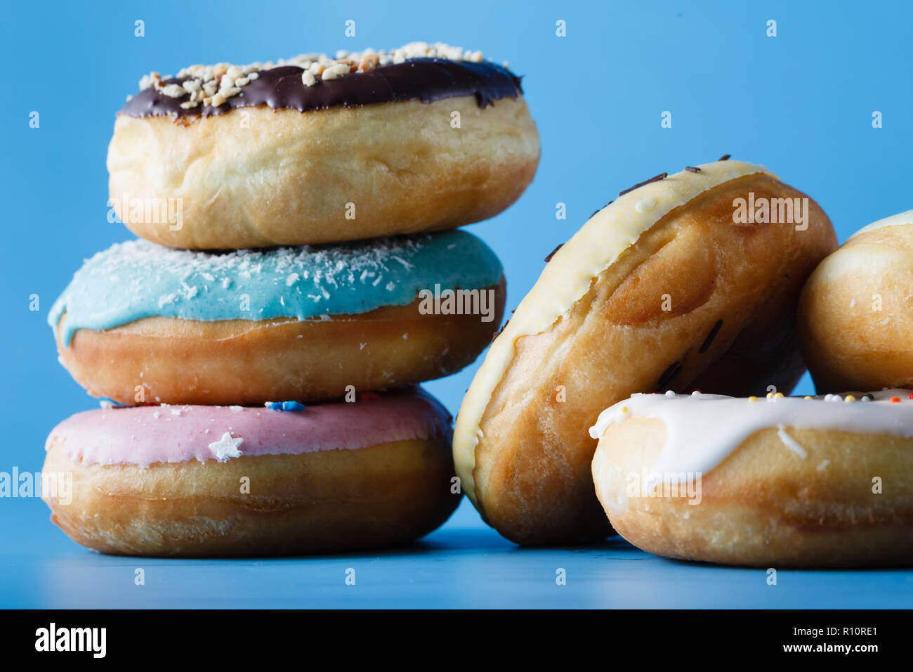 Closeup colorful donuts on shadeless background Stock Photo - Alamy