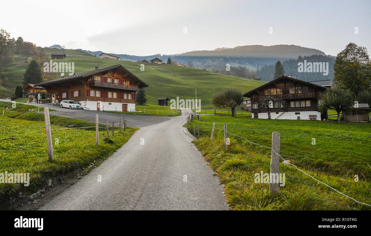 Mountain village at sunset in Grindelwald, Switzerland. Grindelwald was ...