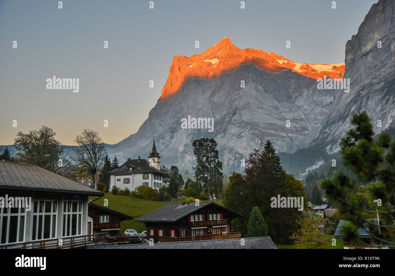 Mountain village at sunrise in Grindelwald, Switzerland. Grindelwald ...