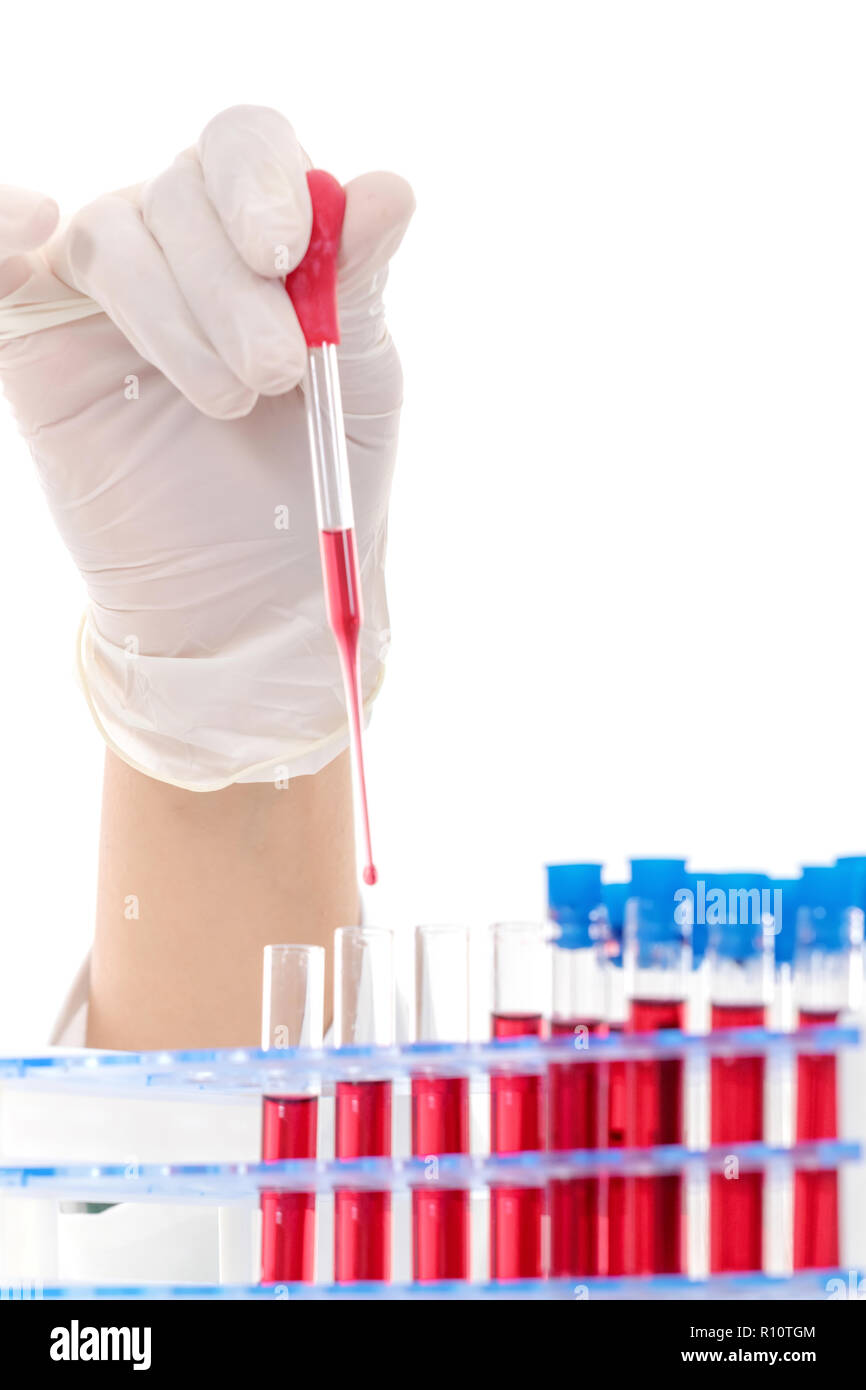 Scientist filling test tubes with pipette in laboratory Stock Photo - Alamy