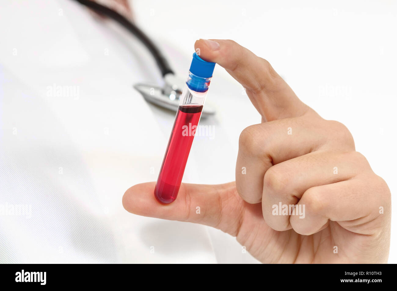 Female doctor holding laboratory test tube. Science test tubes research ...