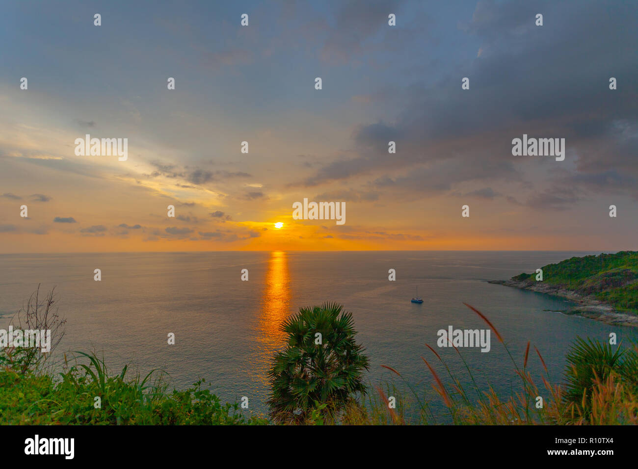 stunning sunset at Promthep cape. colorful of cloud are changing in the ...
