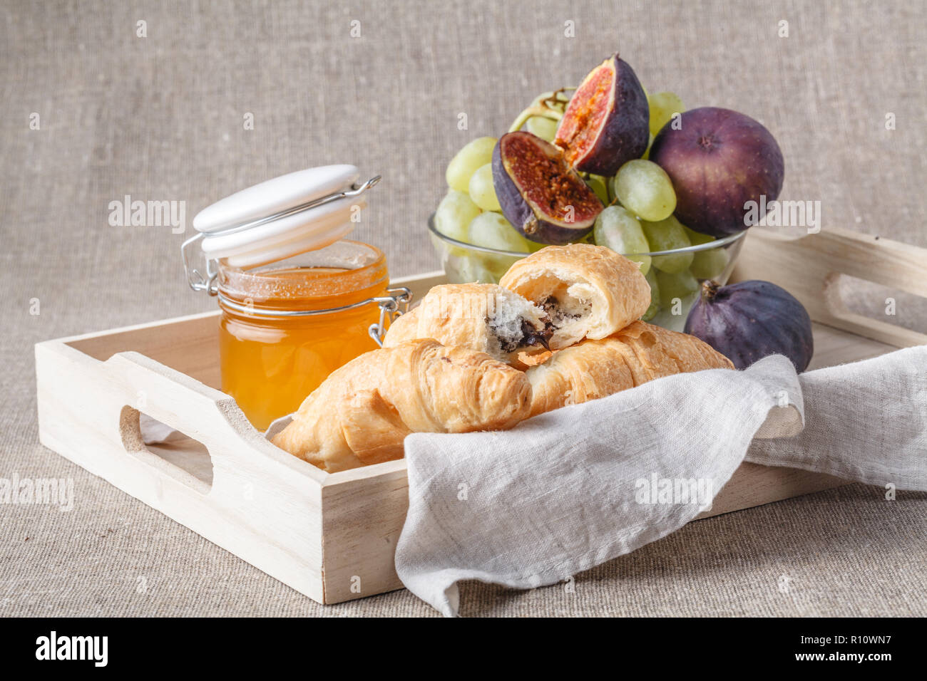 Breakfast with croissant and honey. Continental set Stock Photo - Alamy