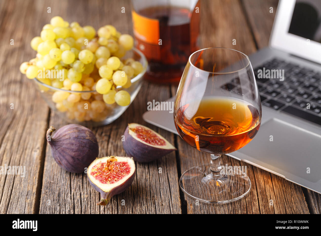 Cognac In Glass, Vintage Wood Background Stock Photo - Alamy