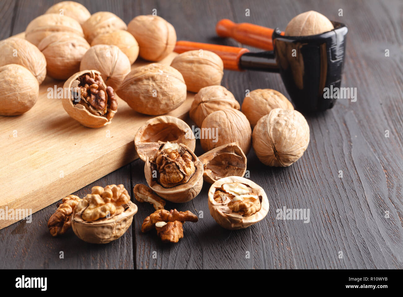 Cracking nut nutcracker on wooden hi-res stock photography and images ...