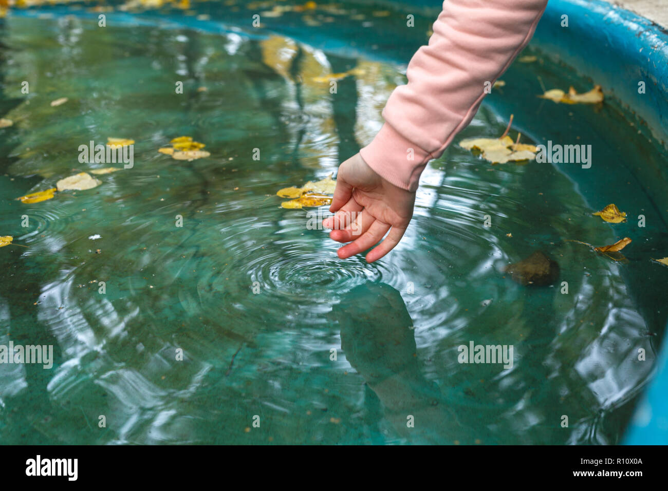 Man getting drinking water from drinking water fountain hi-res stock ...