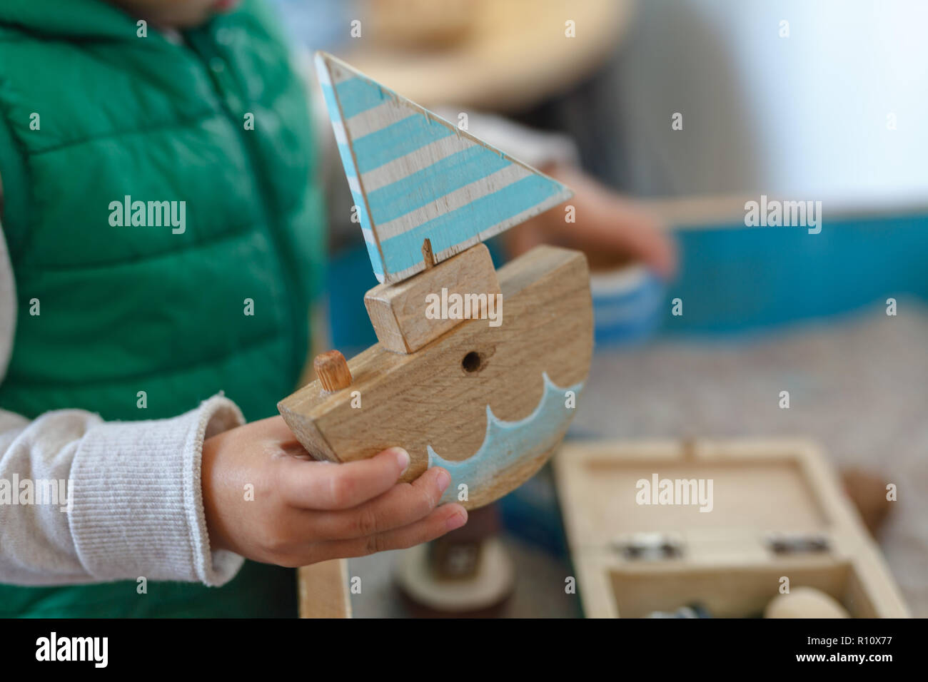 Autistic kid play alone with train toys Stock Photo - Alamy
