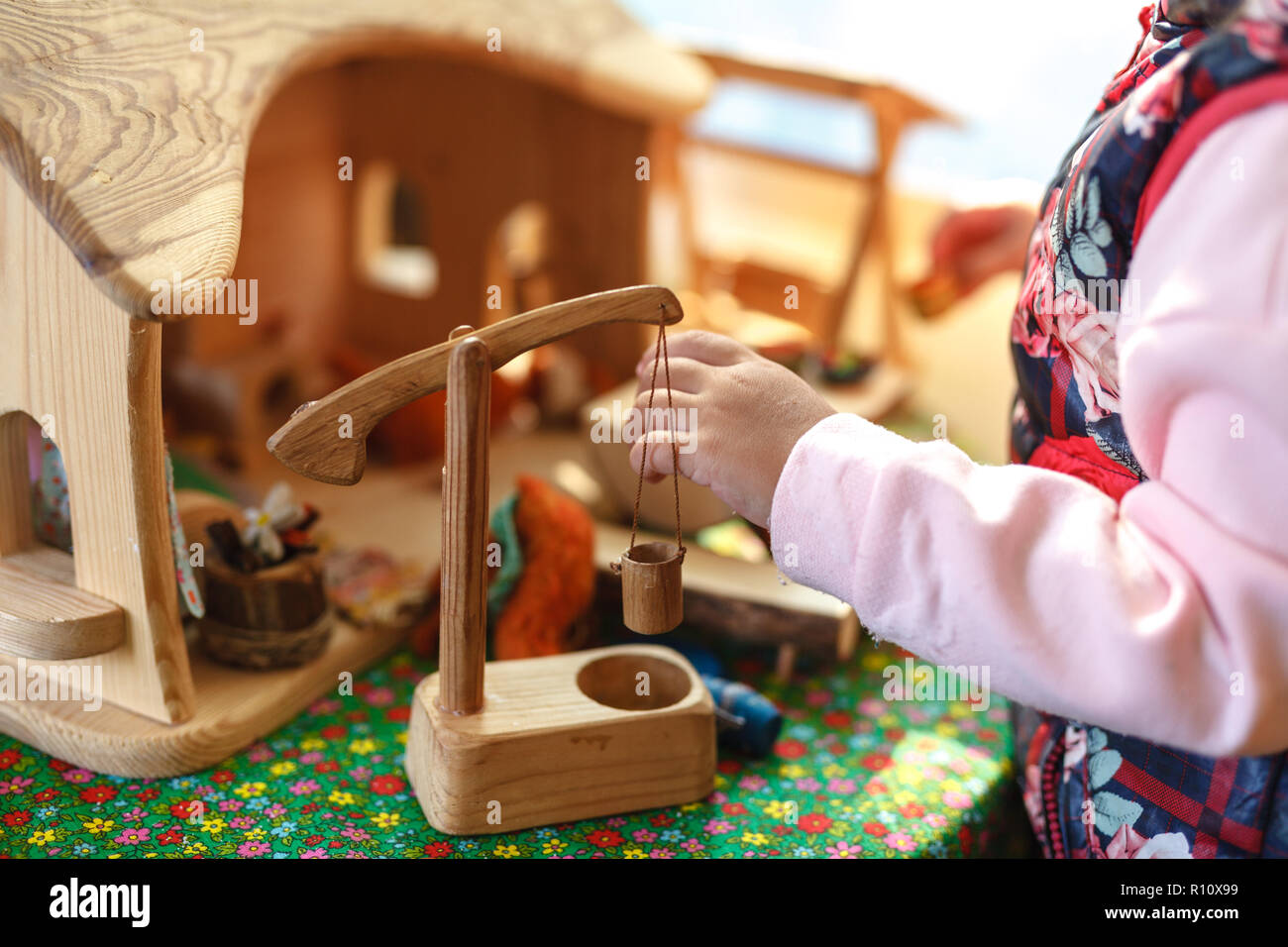 Little autistic boy playing with toy outdoor Stock Photo - Alamy