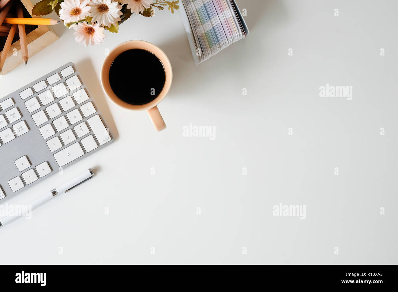 Top view artist workplace with computer, coffee and office supplies ...