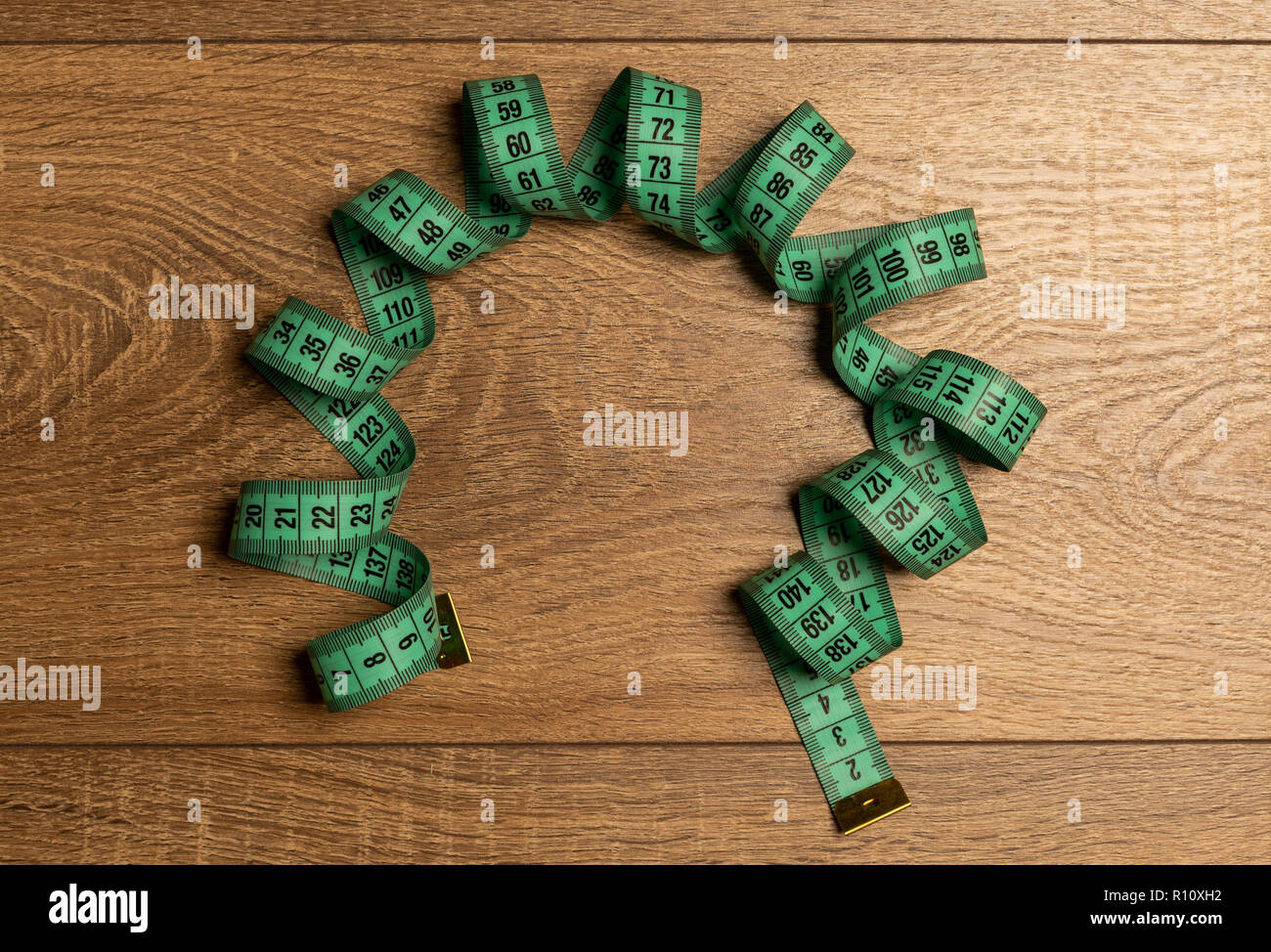 Green measuring tape hi-res stock photography and images - Alamy