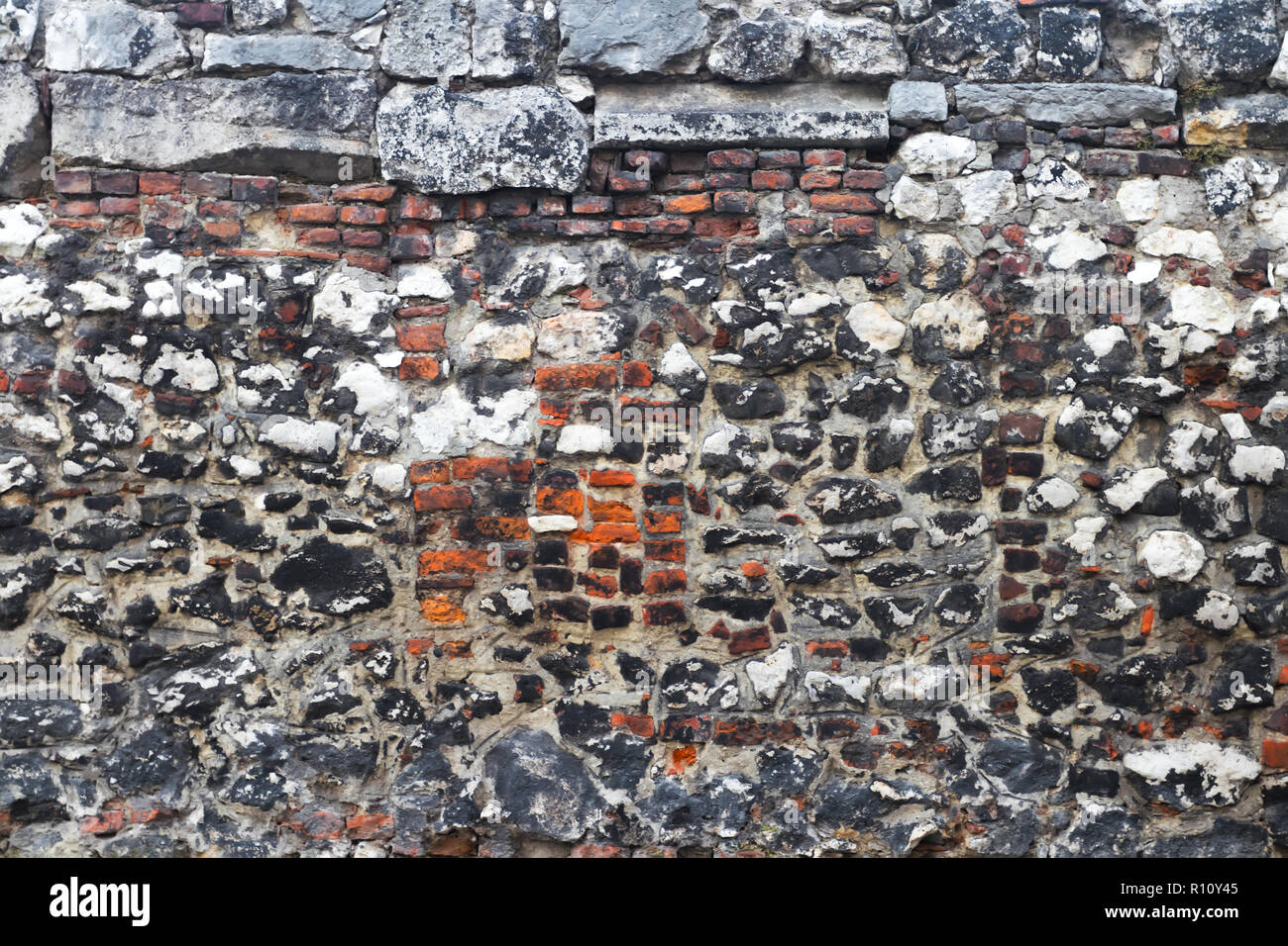 Old rugged stone and brick wall as a background Stock Photo - Alamy