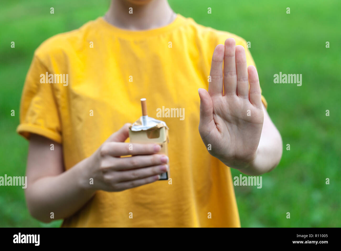 Healthy Young Woman Refusing To Take Cigarette From Pack Stock Photo ...