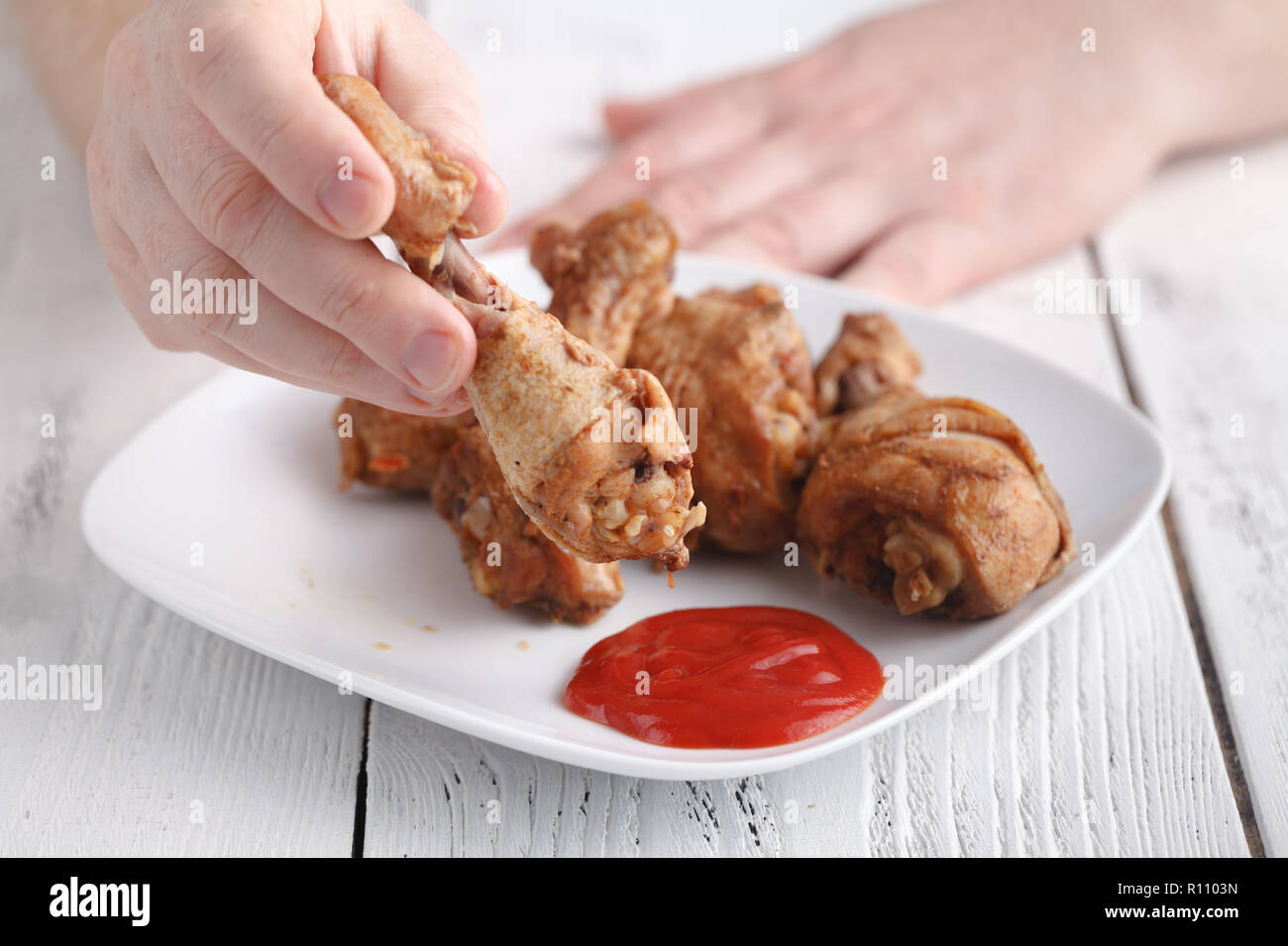 Man eating chicken leg hi-res stock photography and images - Alamy