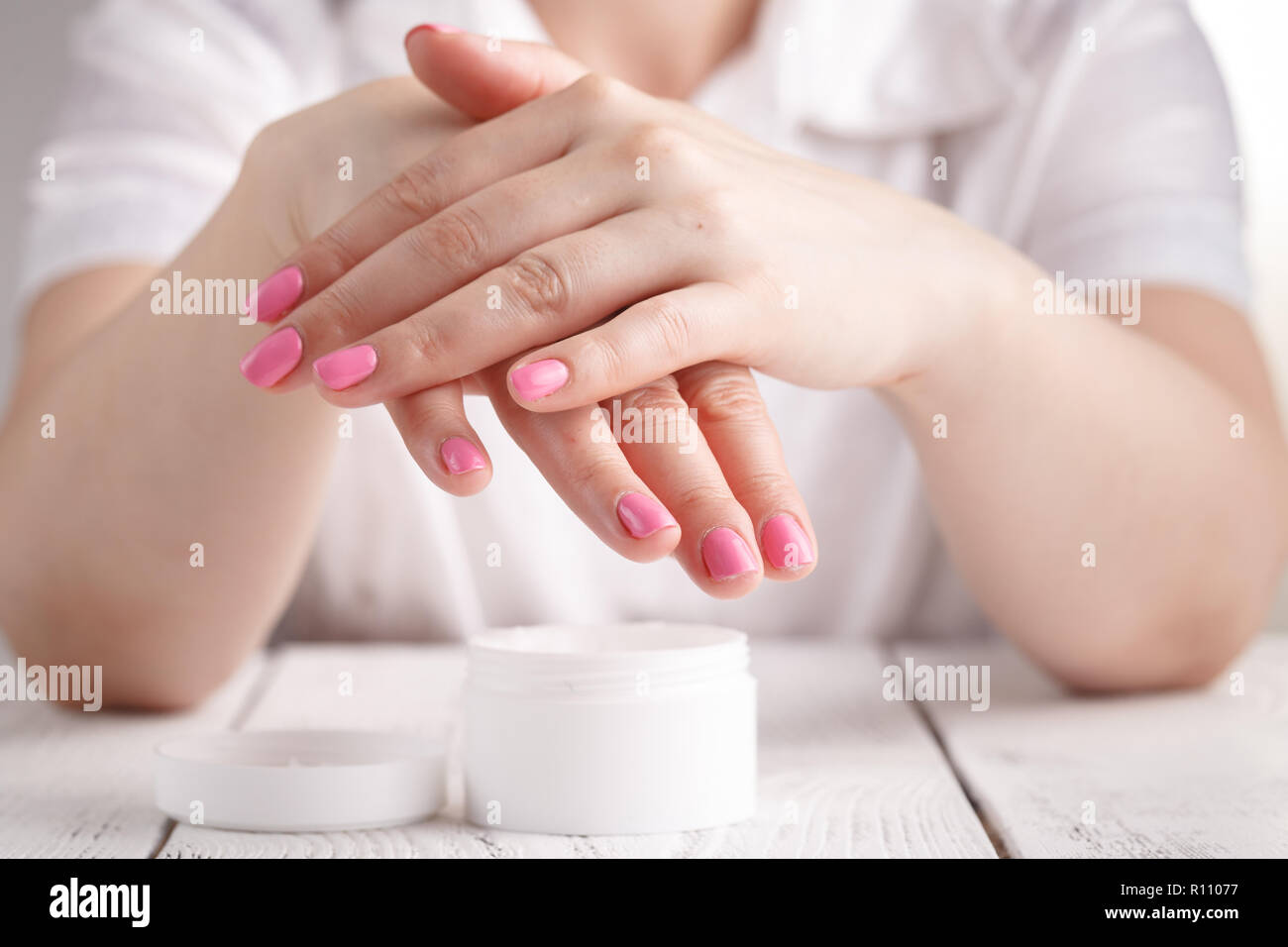 beautiful woman hands with cream Stock Photo - Alamy