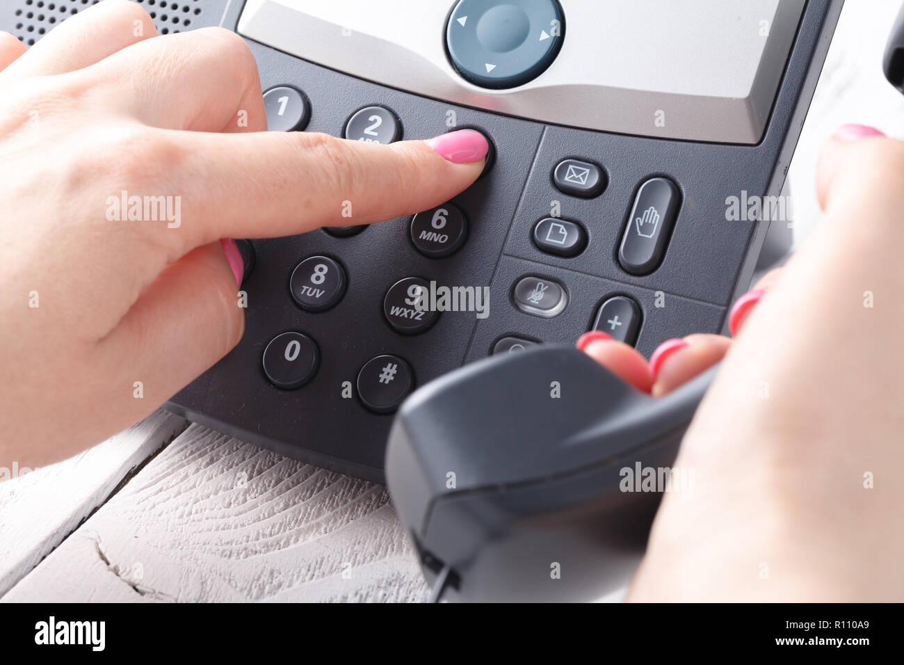 Human hand holding telephone cord hi-res stock photography and images ...