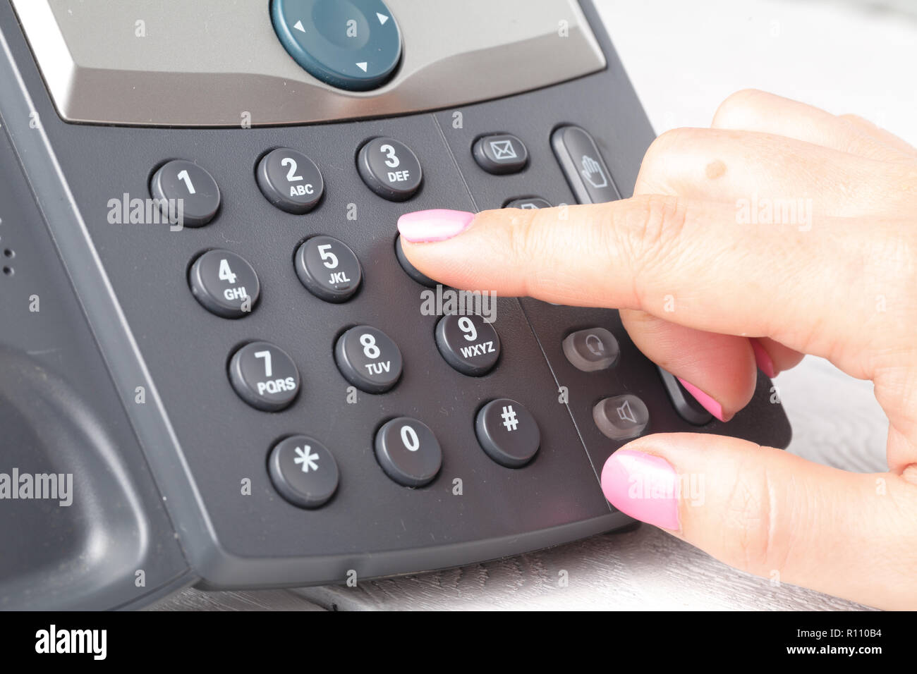 Female hand dialing number in hi-res stock photography and images - Alamy