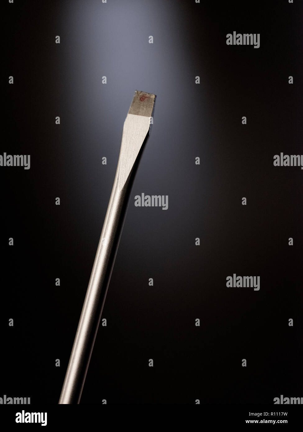 Screwdriver on mostly black background Stock Photo - Alamy