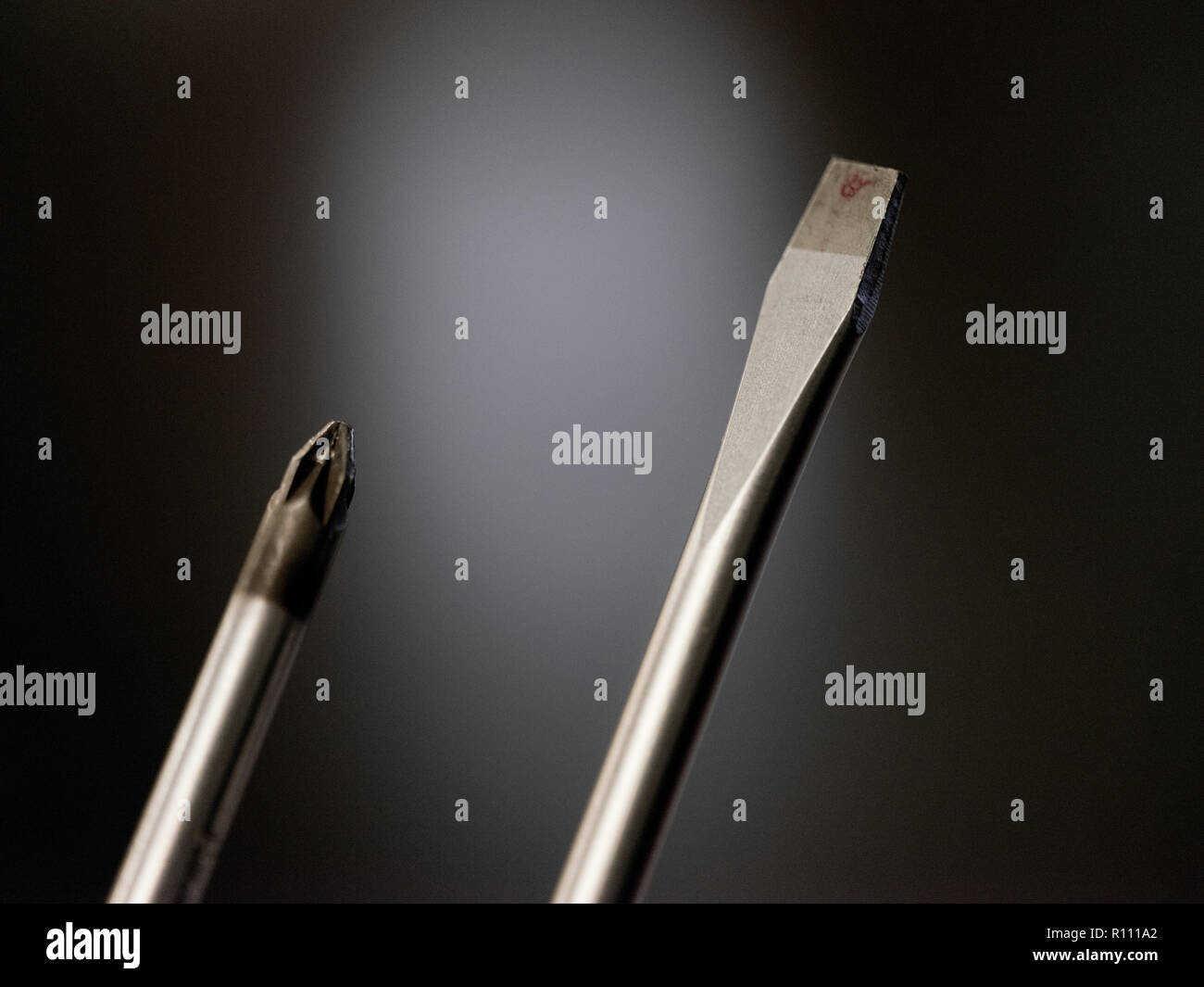 Screwdriver on mostly black background Stock Photo - Alamy