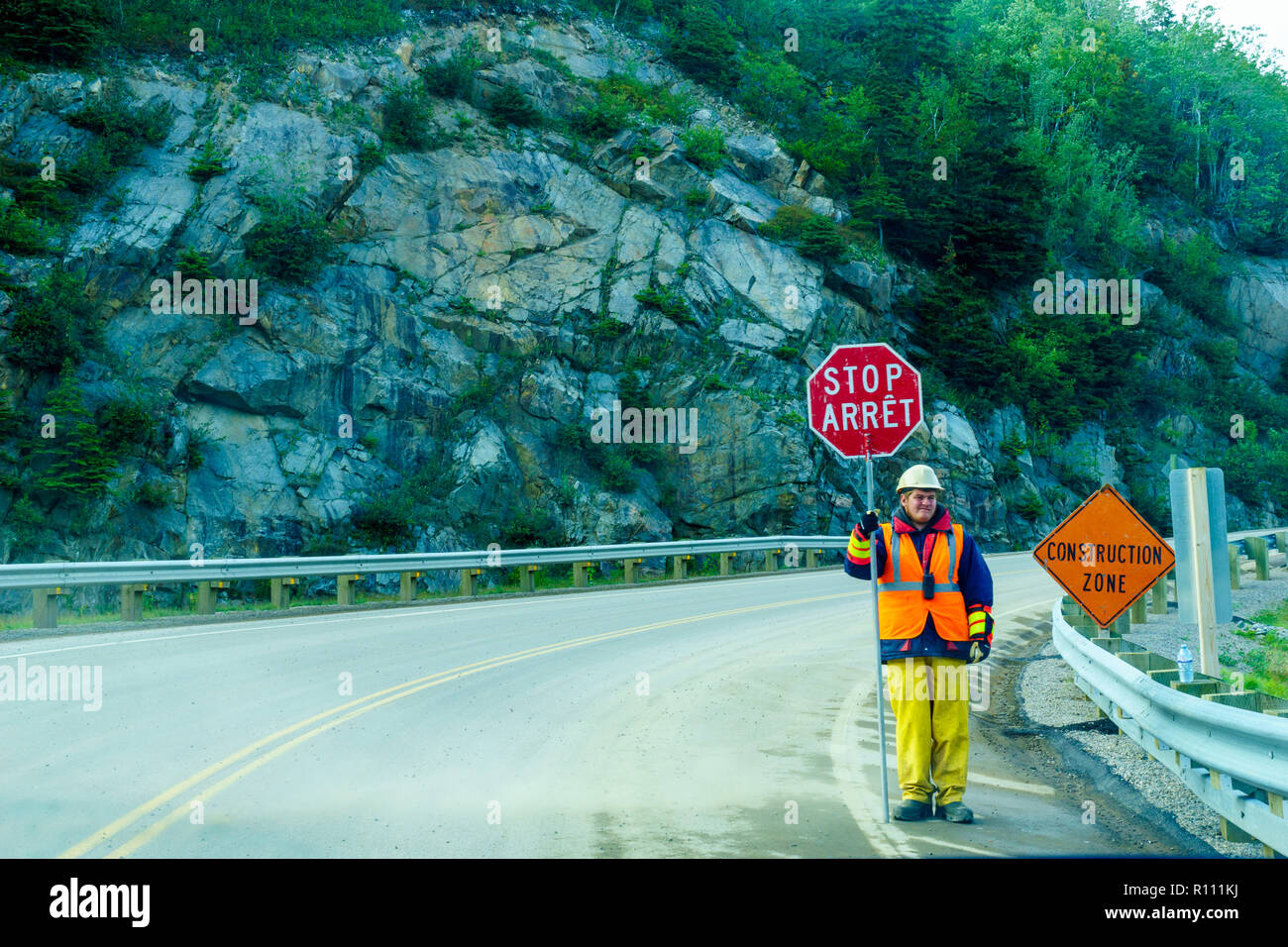 Road worker holding stop sign hi-res stock photography and images - Alamy