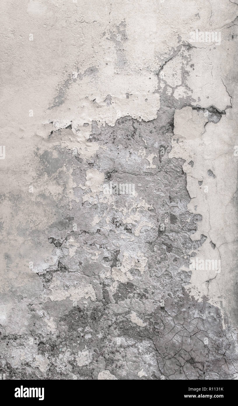 Old wall with white paint peeling off and mold. It can be used as ...